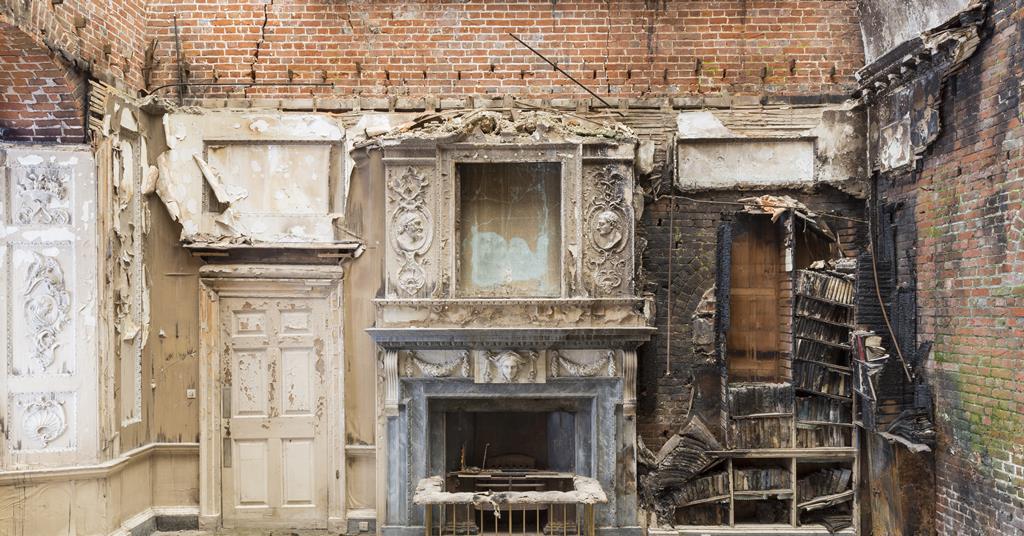 Building firm sued by National Trust after fire at Surrey mansion ...