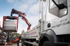 SIG feels winter chill as it posts £77m loss | News | Building